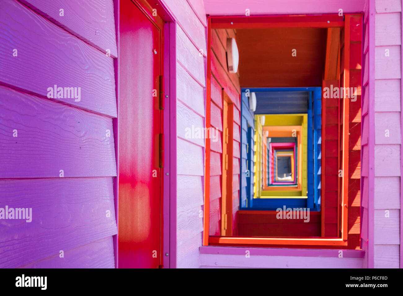Bright color of seaside beach hut windows creating geometric pattern of ...