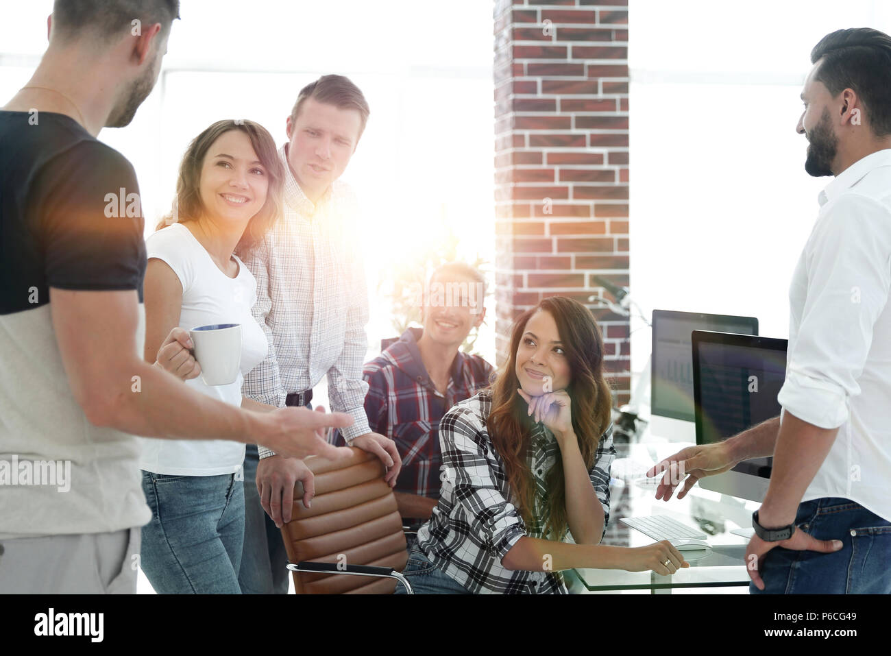 team of young employees discussing Stock Photo - Alamy