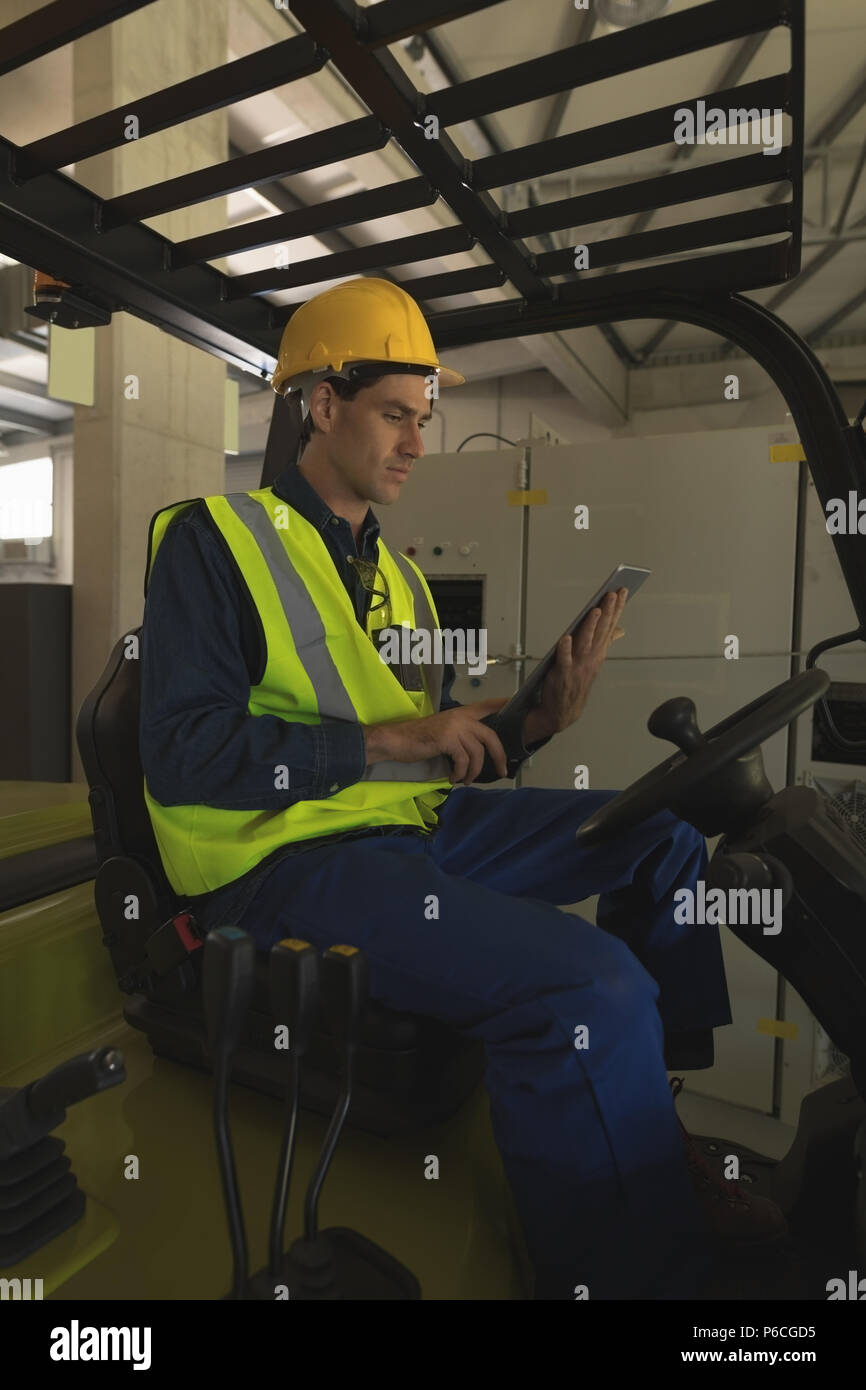 Worker sitting forklift hi-res stock photography and images - Alamy