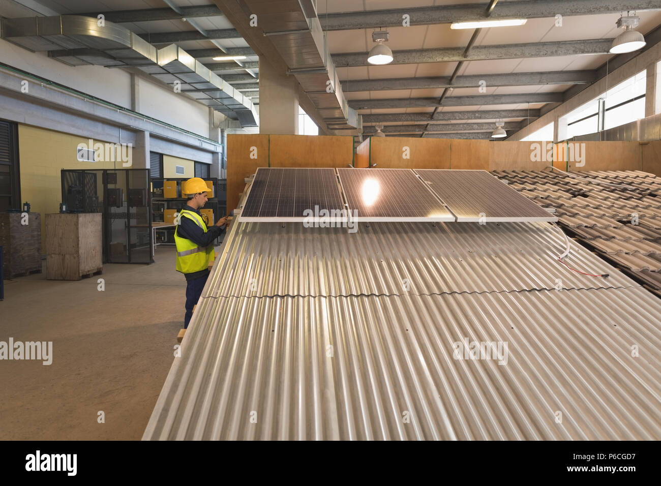 Male worker working on solar panel Stock Photo - Alamy