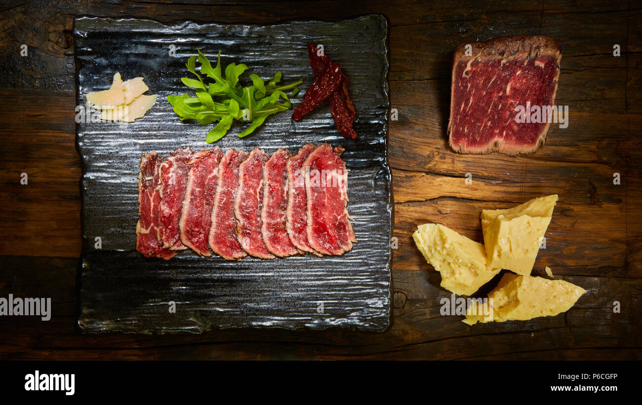 Barbecue wagyu roast beef sliced as top view on a metal tray with copy ...