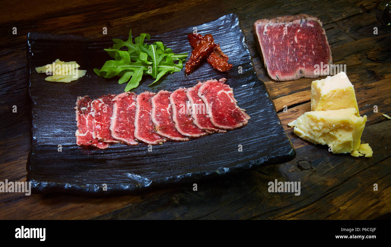 Barbecue wagyu roast beef sliced as top view on a metal tray with copy ...