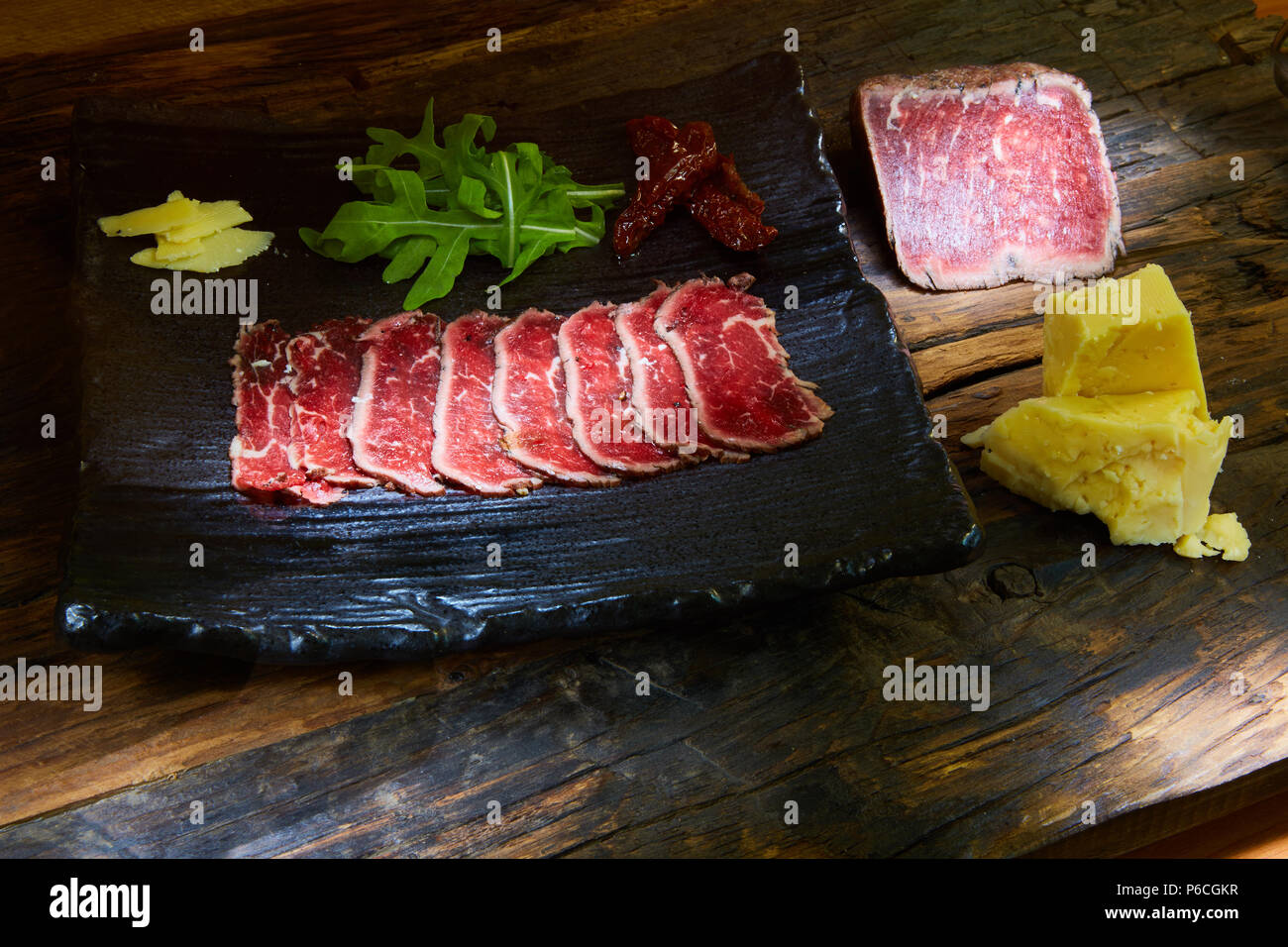 Barbecue wagyu roast beef sliced as top view on a metal tray with copy ...