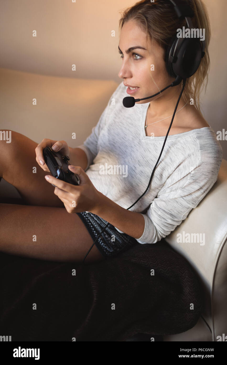 Focused woman playing video game hi-res stock photography and images ...