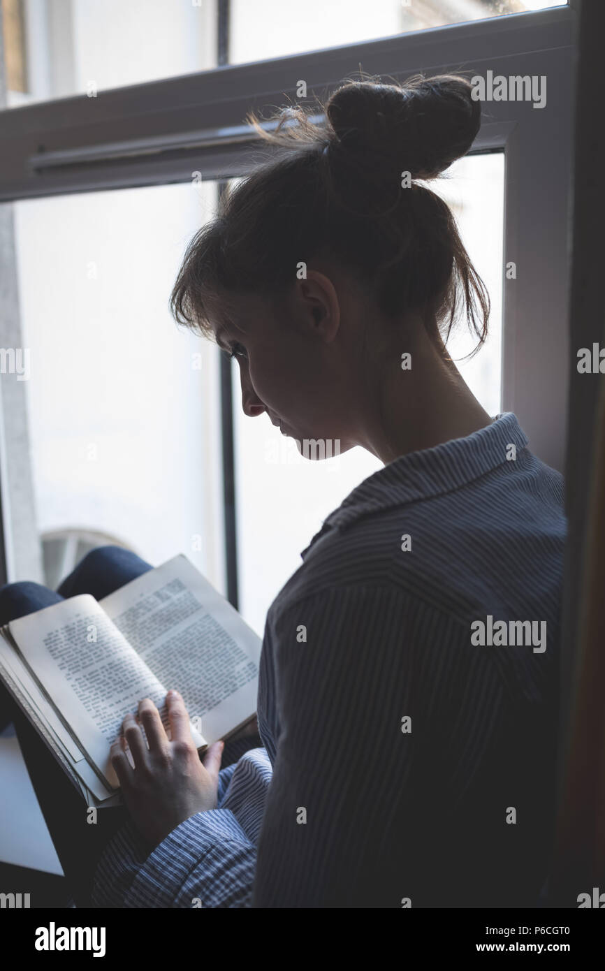 Reading by the window hi-res stock photography and images - Alamy