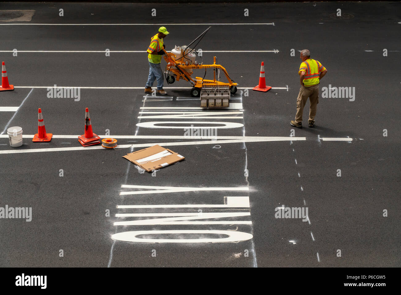 Employees from the New York City Department of Transportation install ...