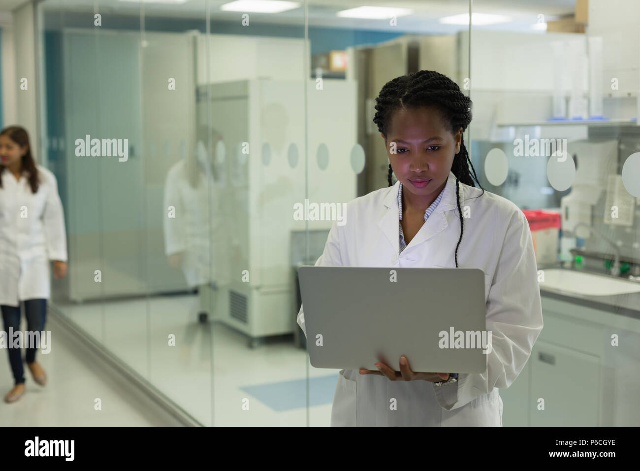 Woman scientist research laptop hi-res stock photography and images - Alamy
