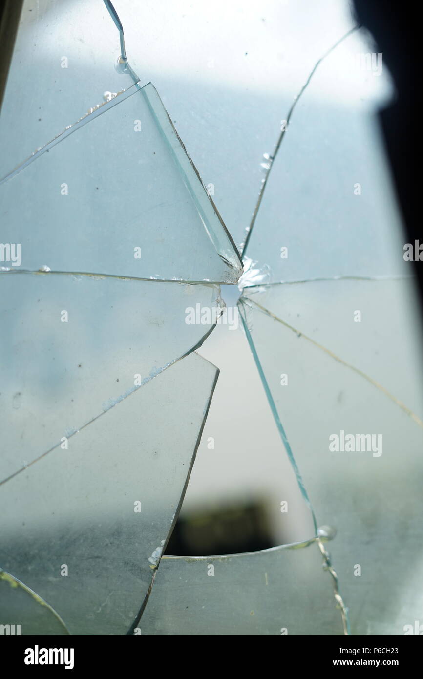 Bullet hole in the window Stock Photo - Alamy