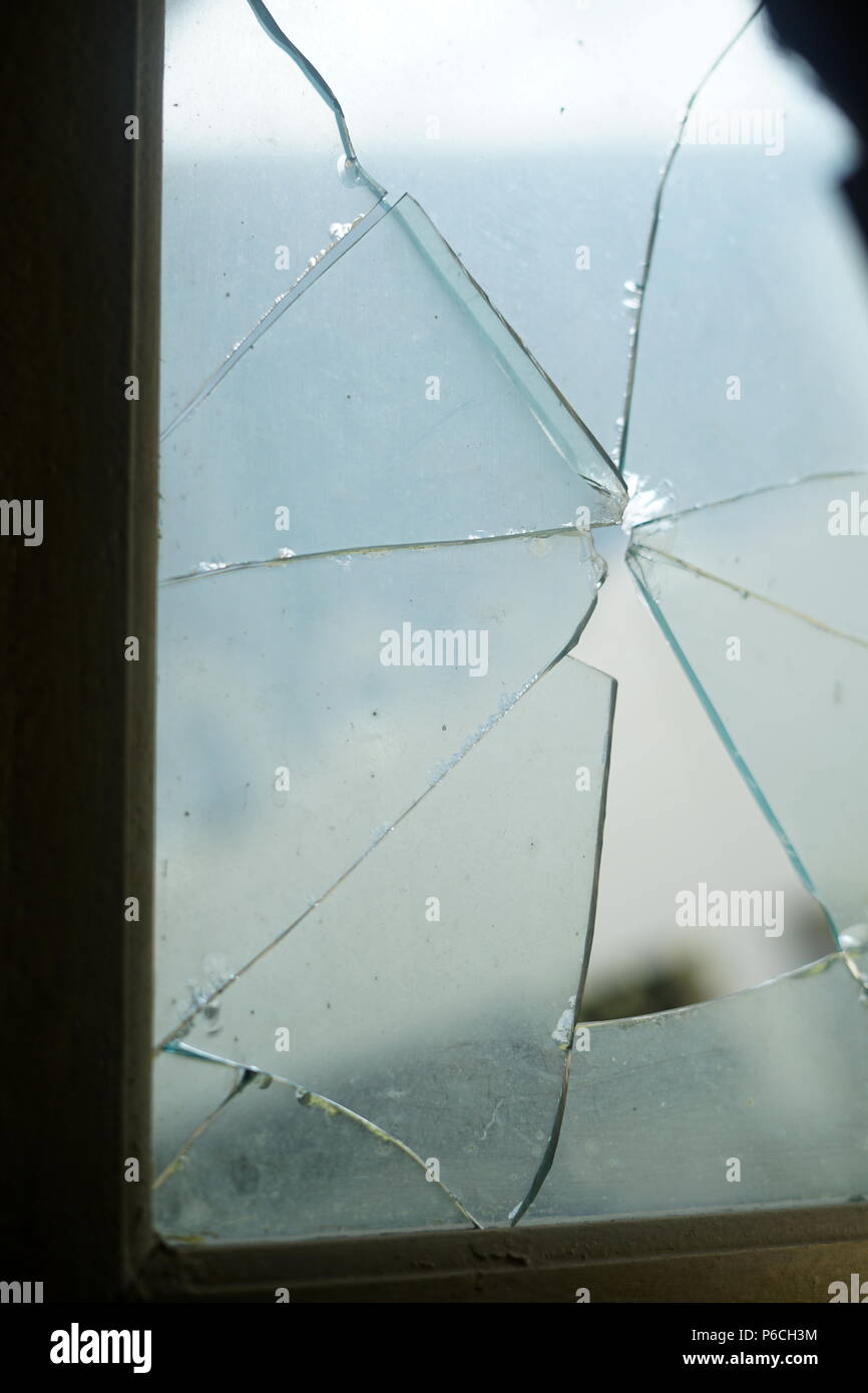 Bullet hole in the window Stock Photo - Alamy