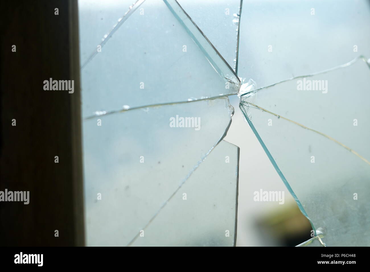 Bullet hole in the window Stock Photo - Alamy