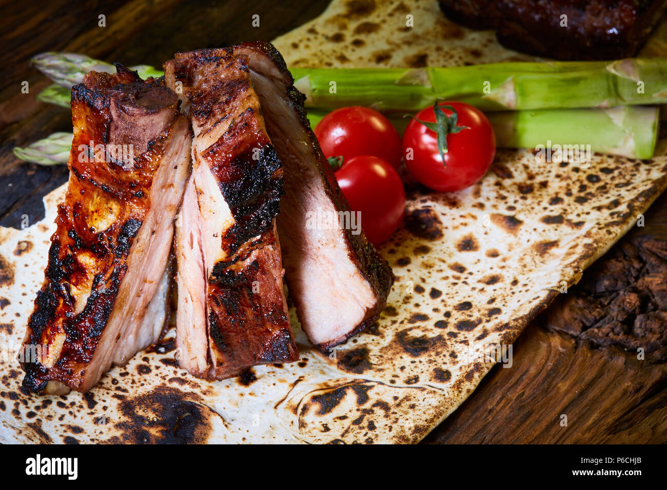Roasted sliced barbecue pork ribs, focus on sliced meat Stock Photo - Alamy