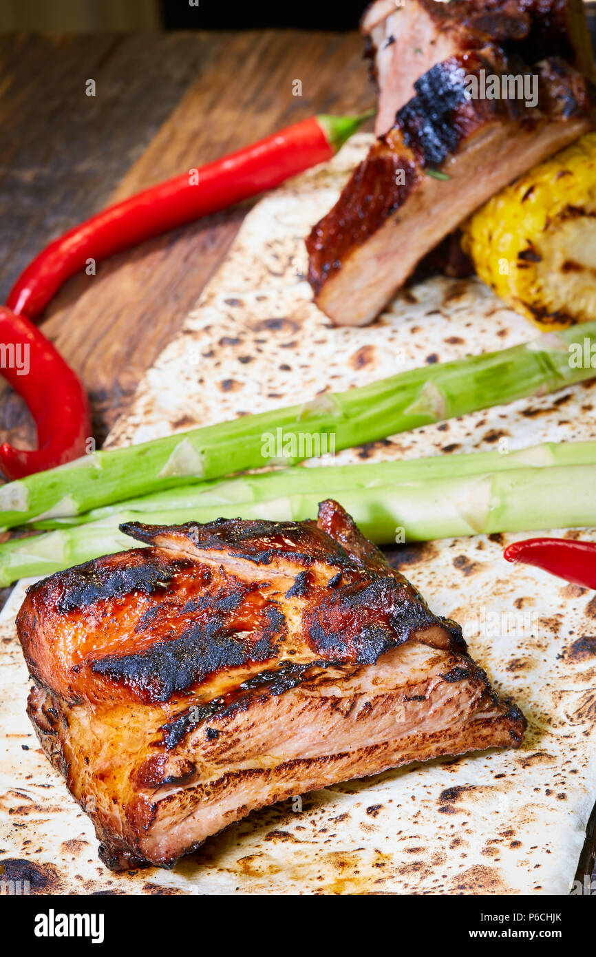 Roasted sliced barbecue pork ribs, focus on sliced meat Stock Photo - Alamy