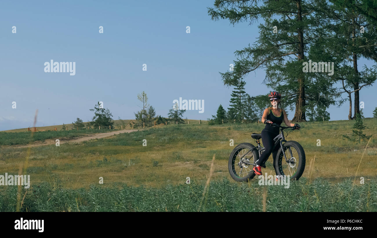 Fat bike also called fatbike or fat-tire bike in summer riding in the ...