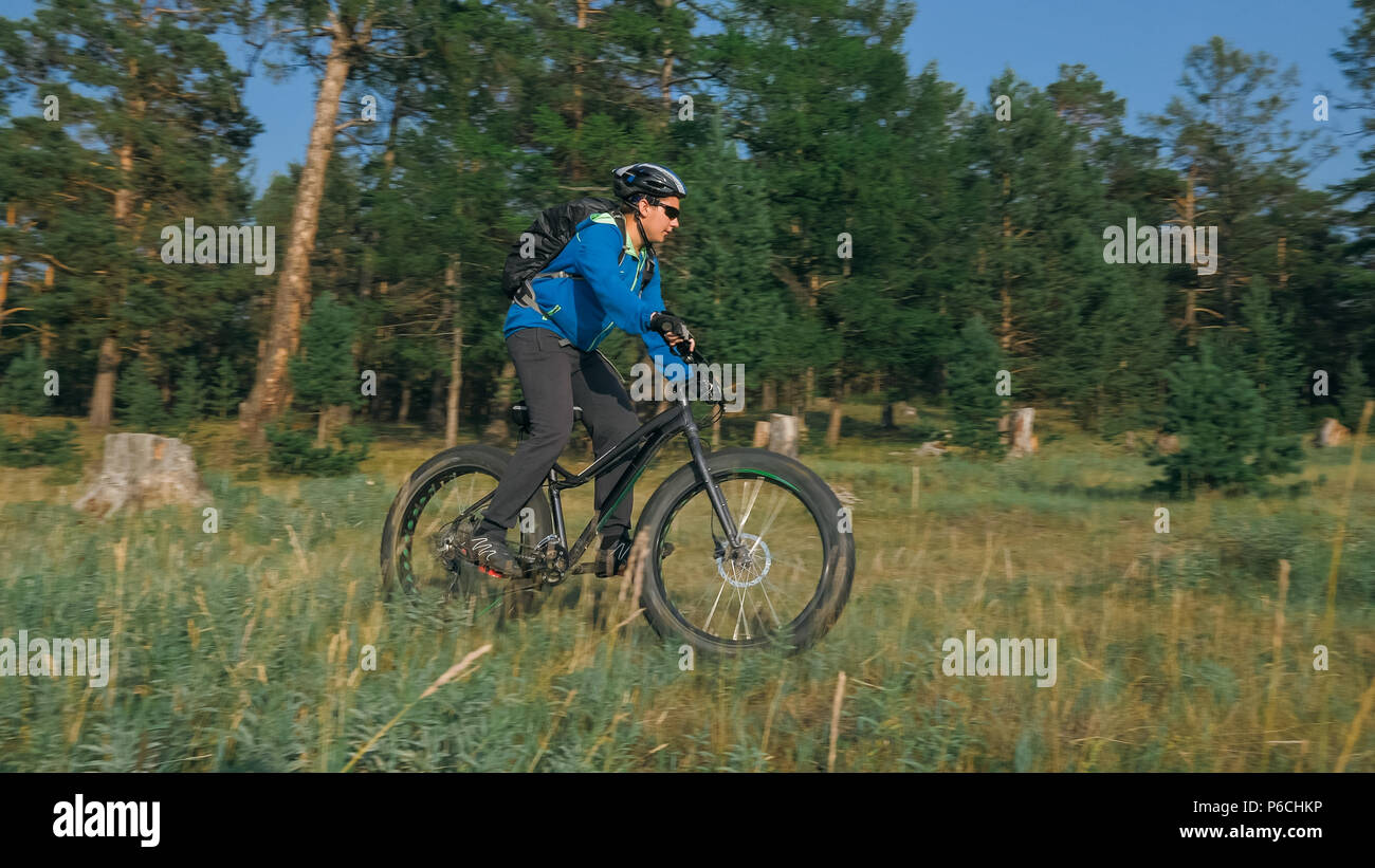Fat bike also called fatbike or fat-tire bike in summer riding in the ...