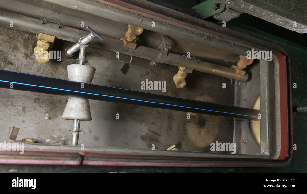 Pipes manufacturing production line. Manufacture of plastic water pipes ...