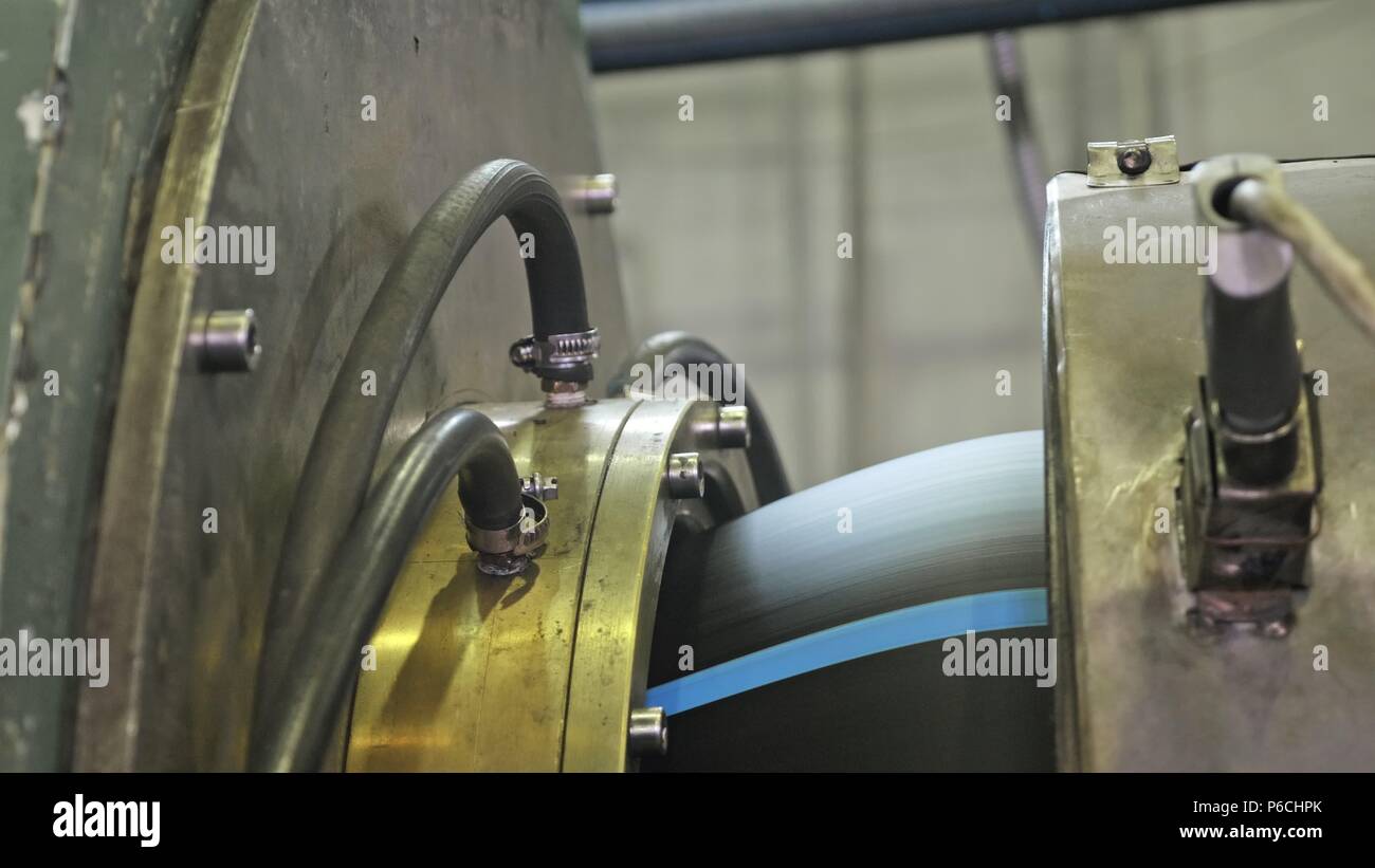 Pipes manufacturing production line. Manufacture of plastic water pipes ...