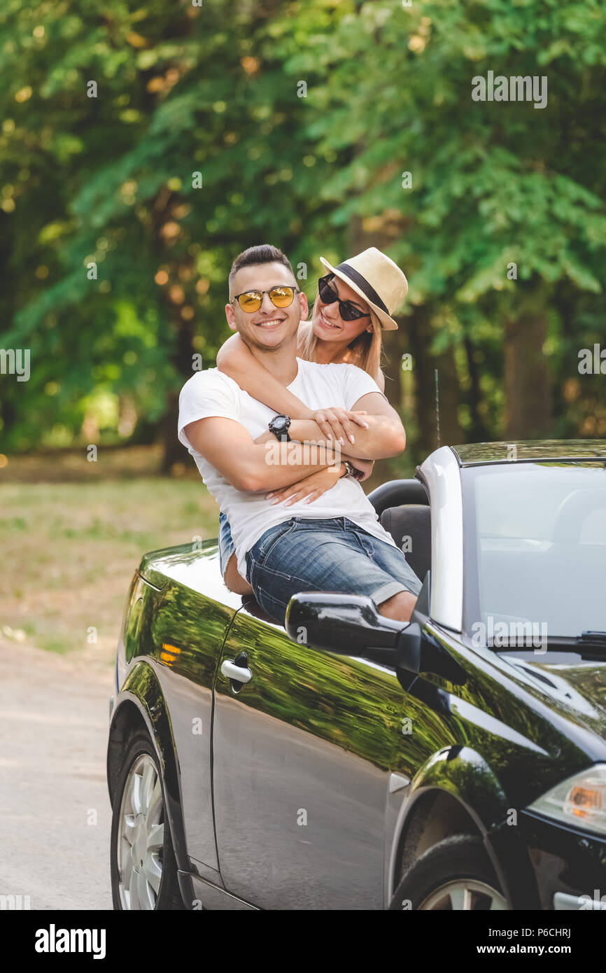 Beautiful happy couple in convertible car. Travel concept Stock Photo ...