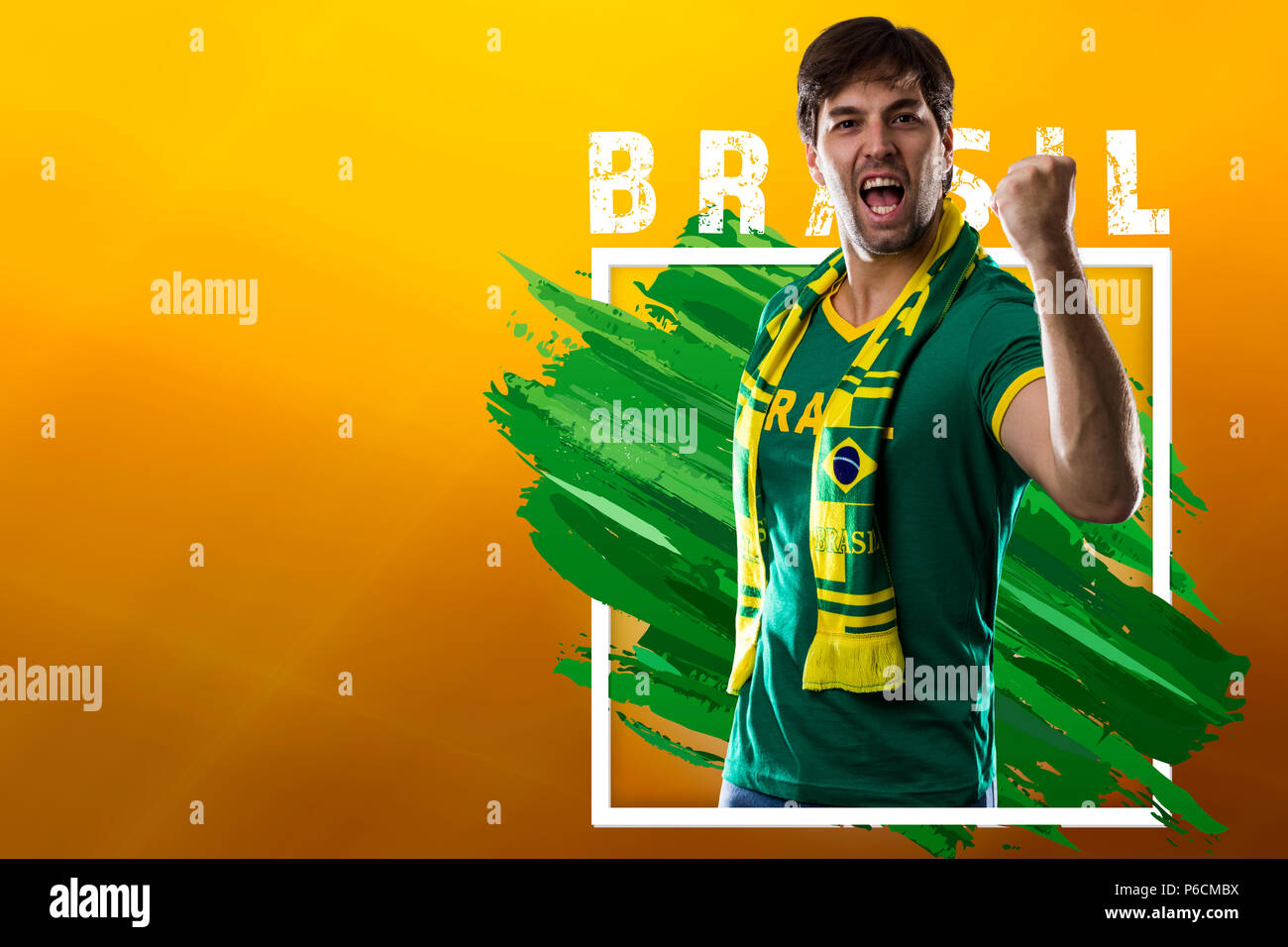Brazilian male fan, celebrating on a yellow background with copy space ...