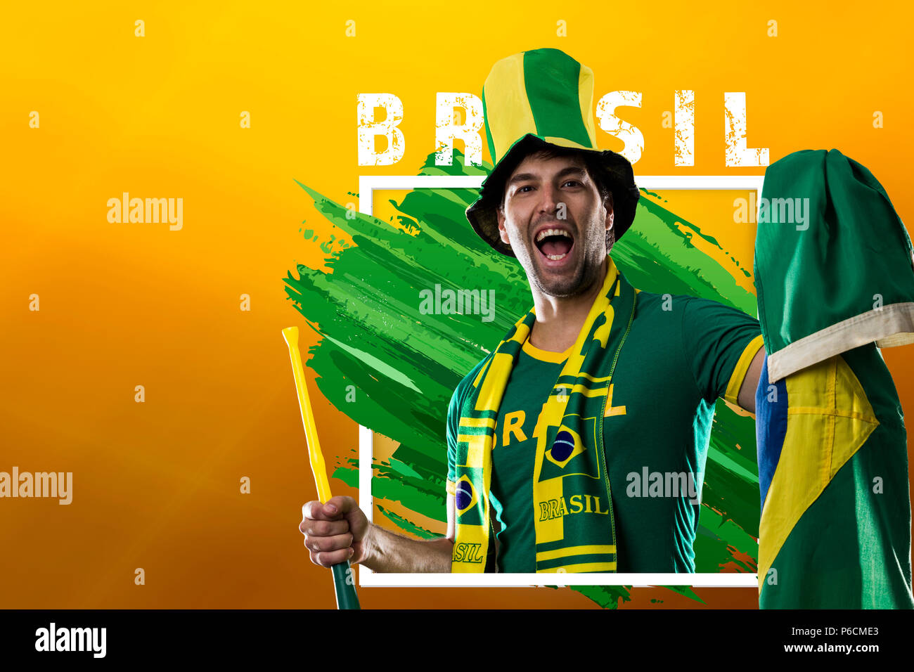 Brazilian male fan, celebrating on a yellow background with copy space ...