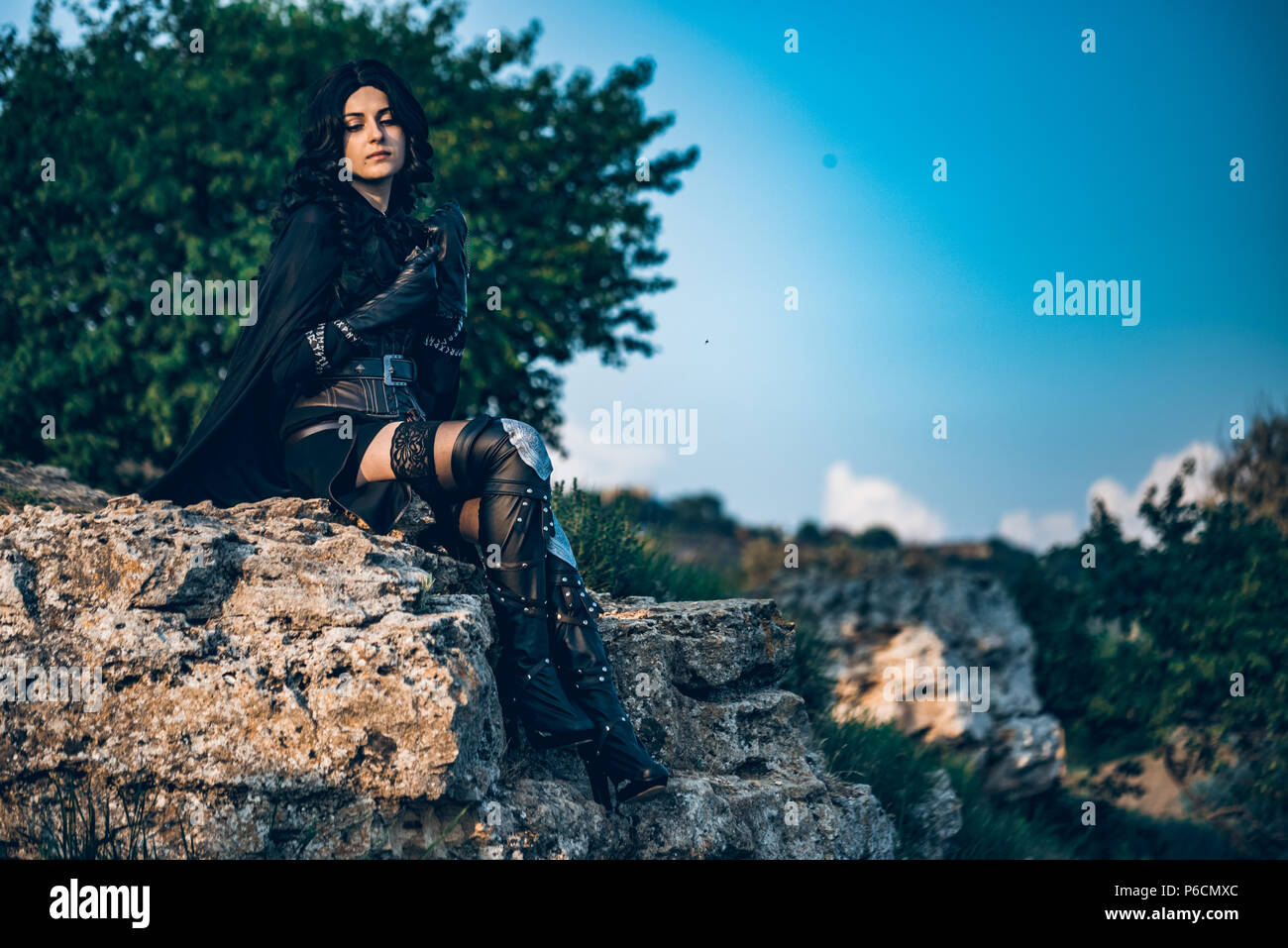 Fantasy cosplay beautiful Witcher girl on cliff Stock Photo - Alamy