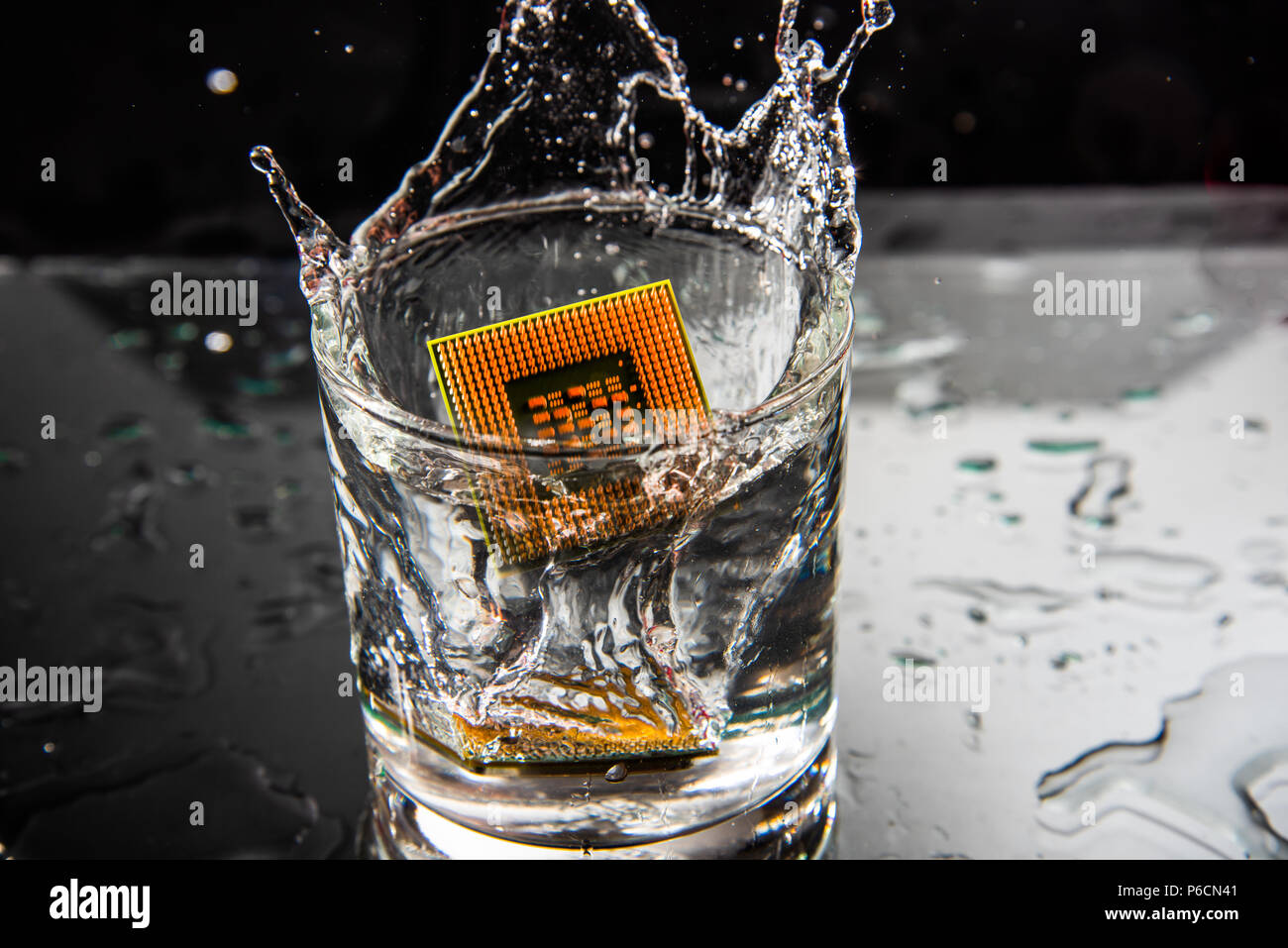 CPU falling into water glass Stock Photo - Alamy