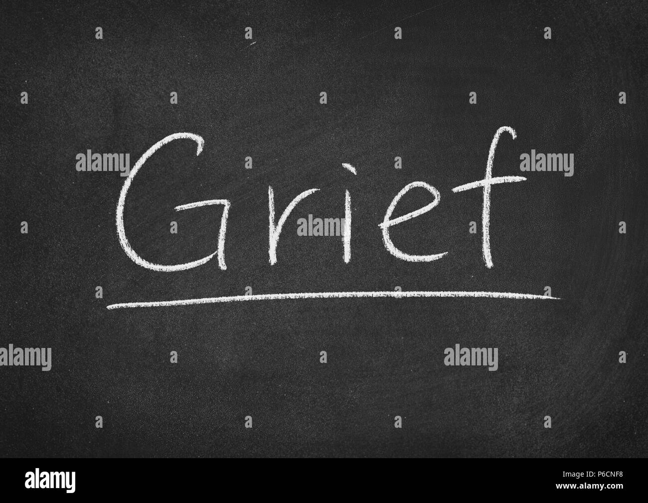 grief concept word on a blackboard background Stock Photo - Alamy