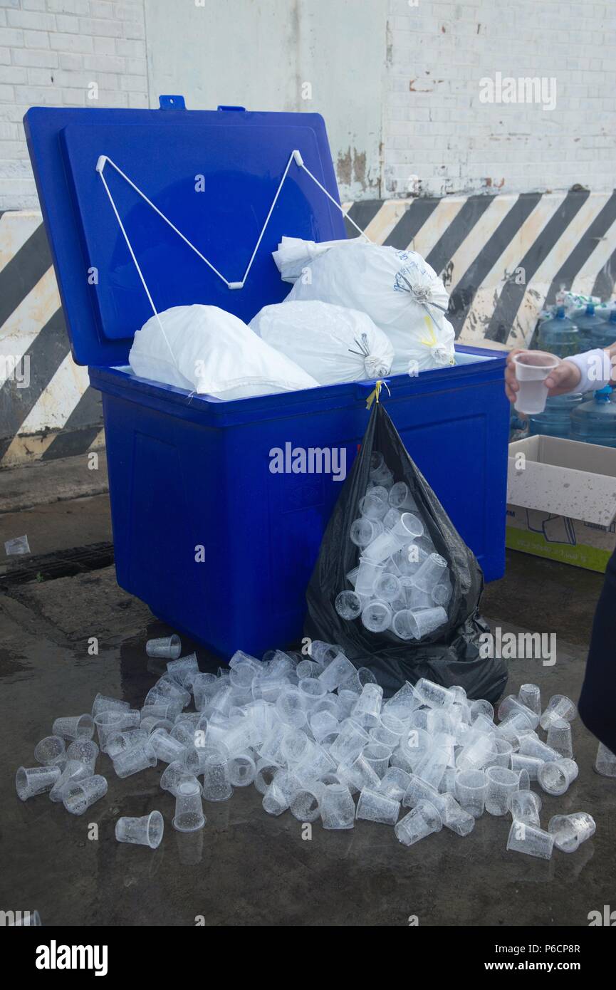 Recyclable garbage of plastic glass in rubbish bin and floor Stock ...