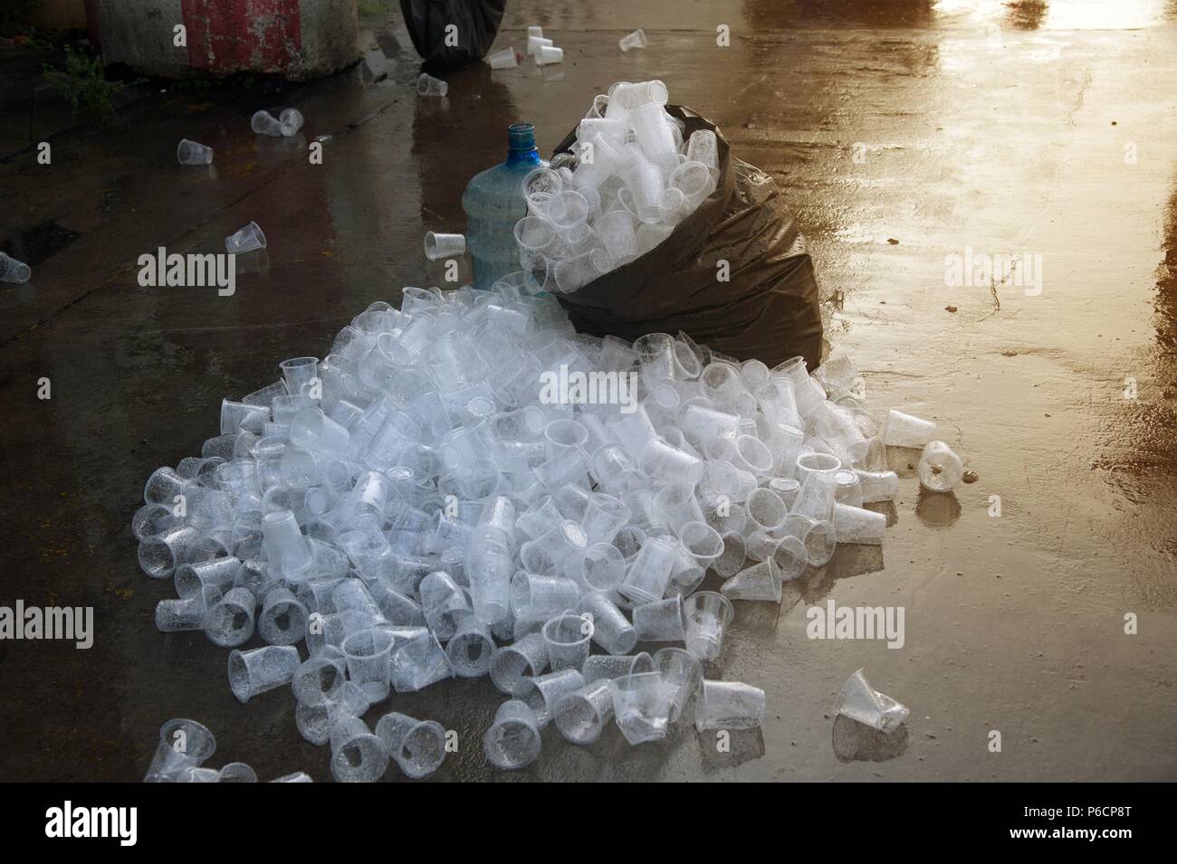 Recyclable garbage of plastic glass in rubbish bin and floor Stock ...