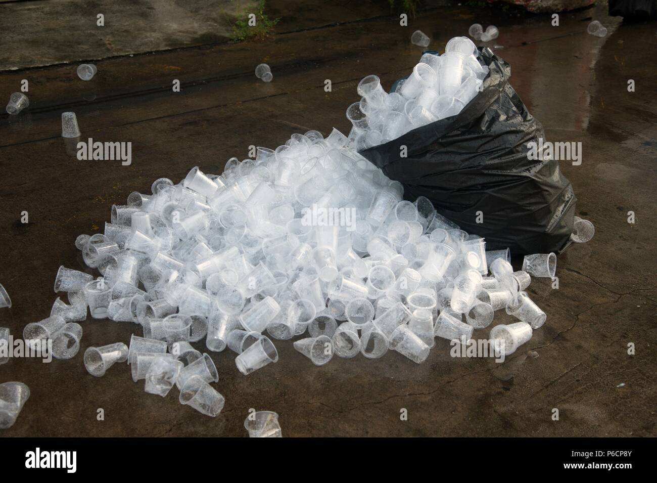 Recyclable garbage of plastic glass in rubbish bin and floor Stock ...