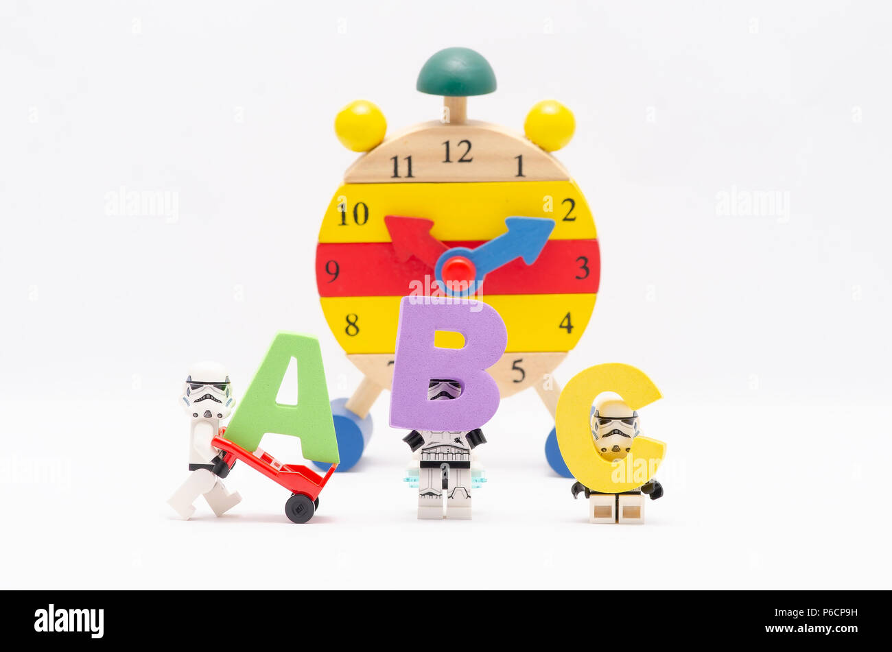 lego storm troopers holding alphabets abc with clock as a background ...