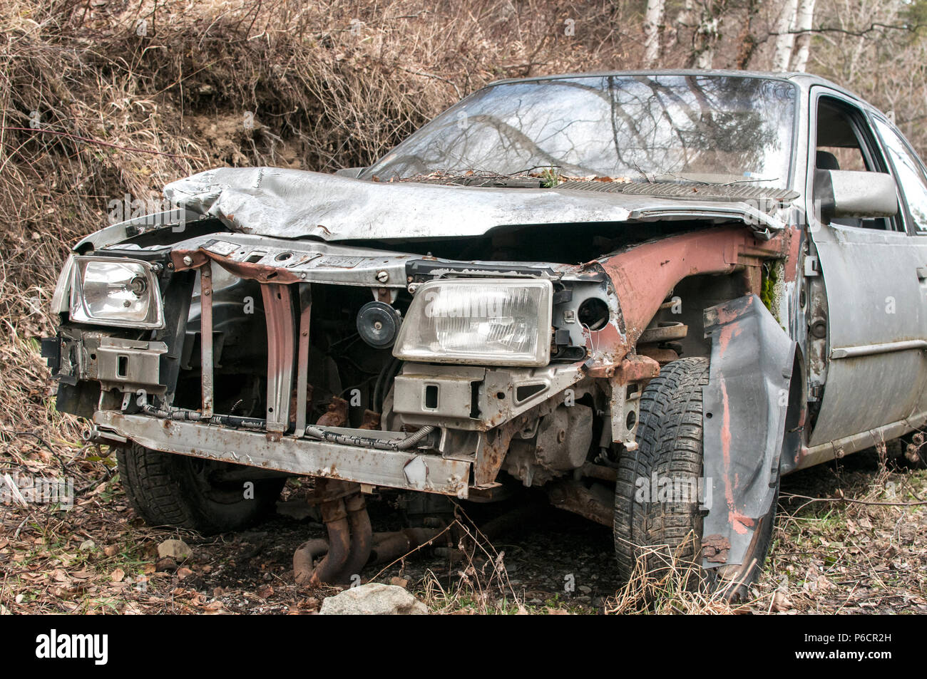 Abandoned crashed destroyed broken car on country road Stock Photo - Alamy
