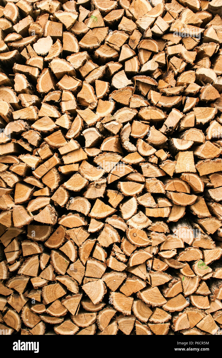 Stacked cut oak firewood closeup as background Stock Photo - Alamy