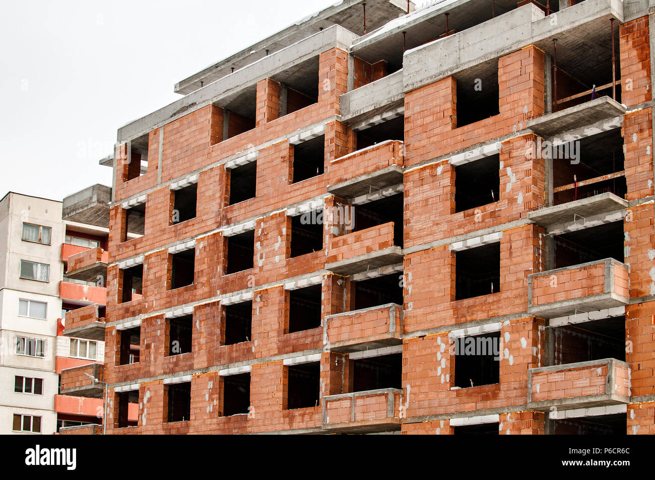 Residential solid building house under construction in red bricks shell ...