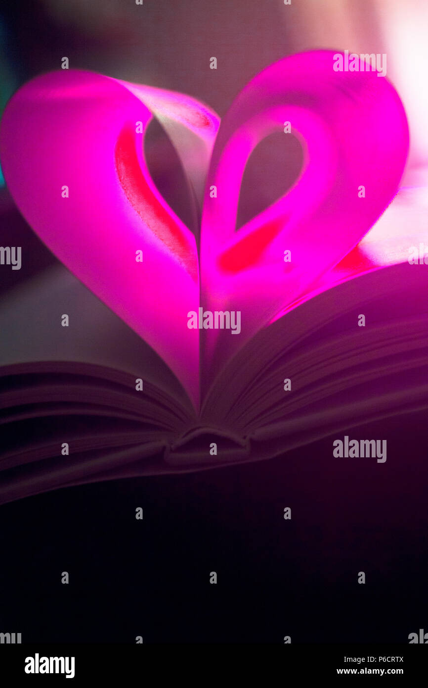 Heart shape made from book pages hi-res stock photography and images ...