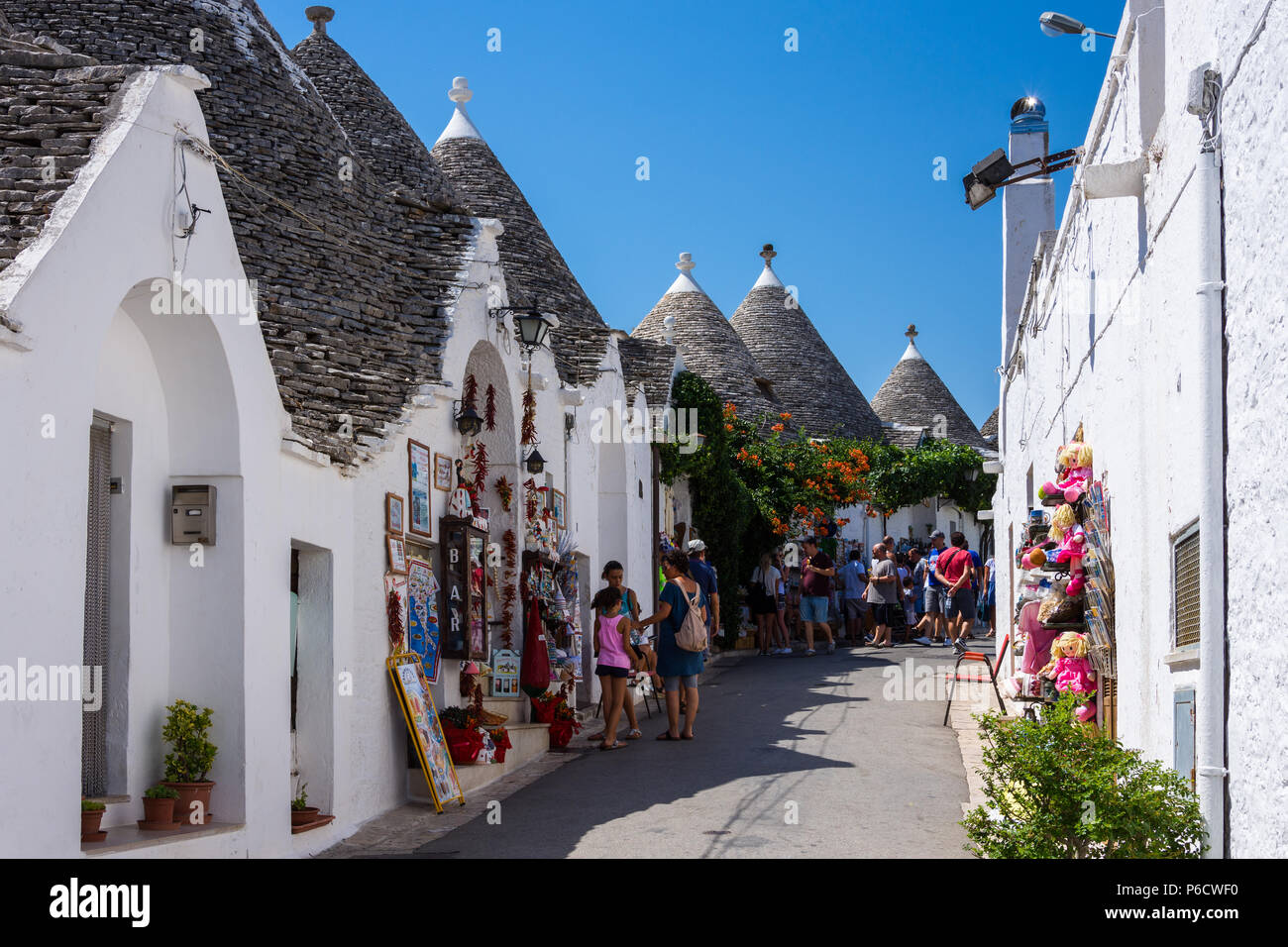 ALBEROBELLO, ITALY - August 10, 2017: People visit Alberobello, Italy ...