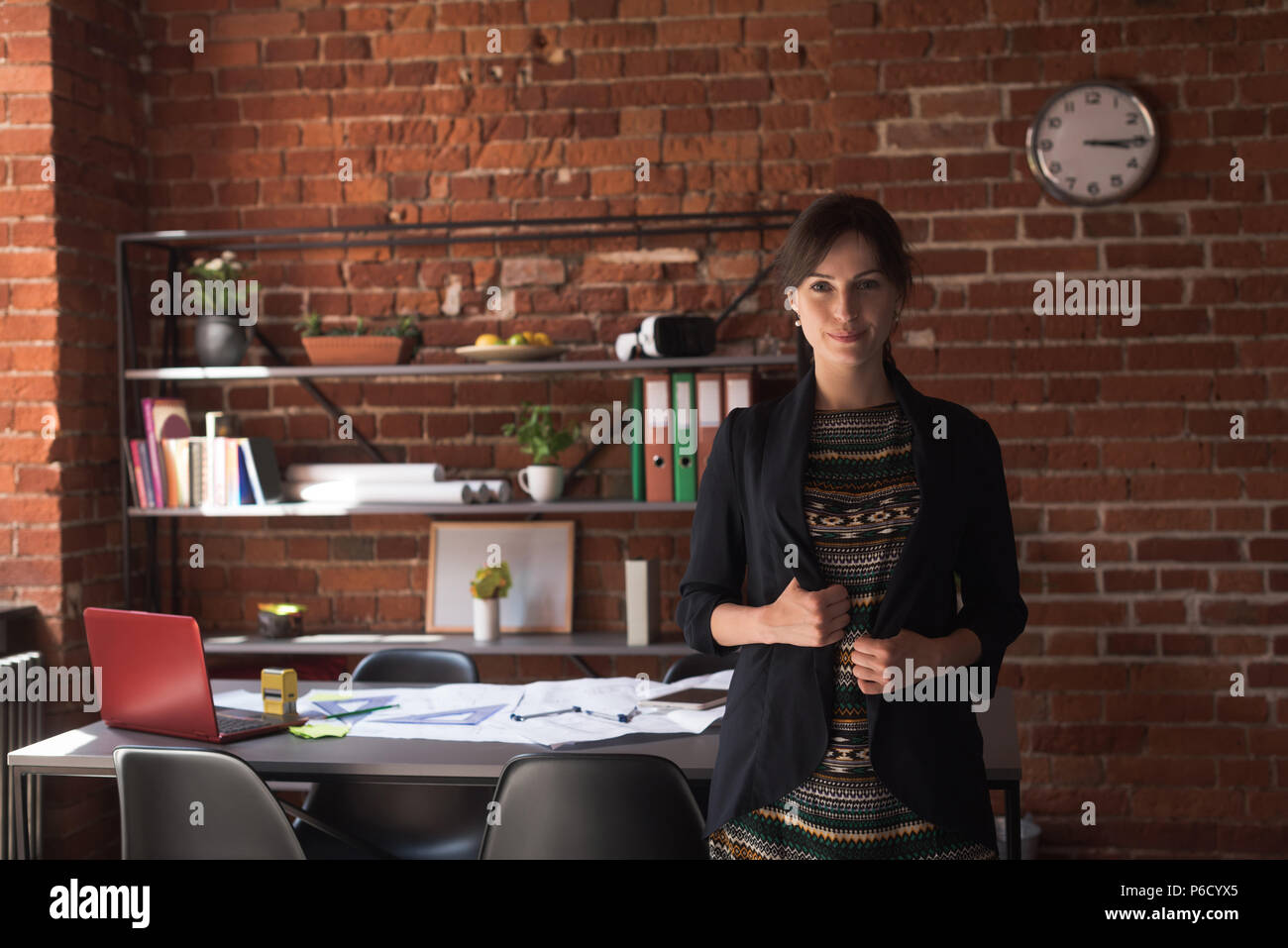 Female executive standing hi-res stock photography and images - Alamy