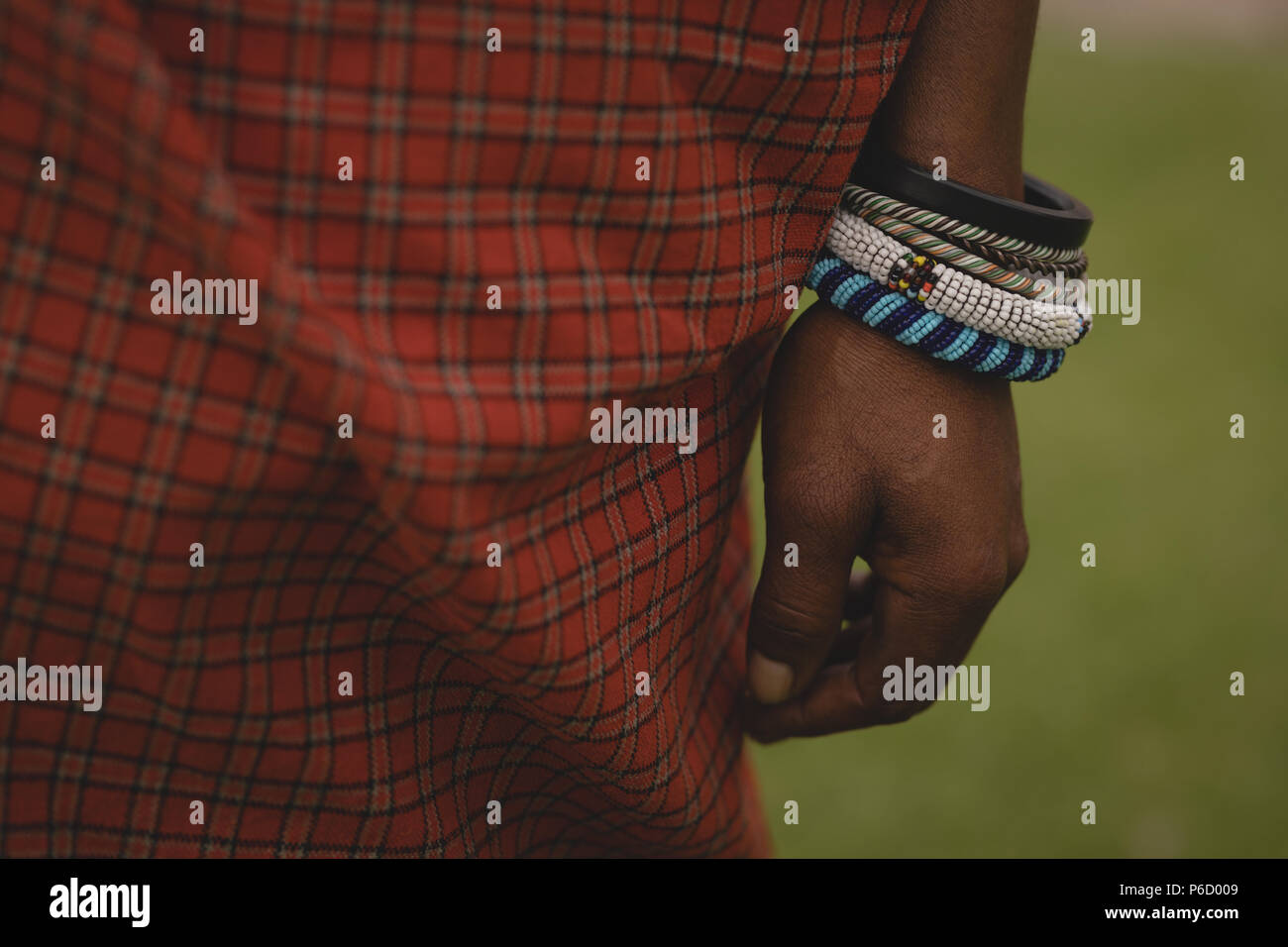 Bangles in maasai man hand Stock Photo - Alamy