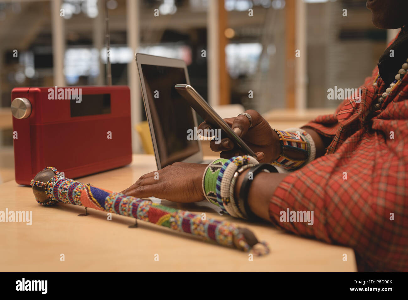 Maasai man in traditional clothing using mobile phone Stock Photo - Alamy