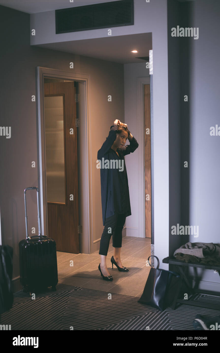 Woman getting ready in hotel Stock Photo - Alamy
