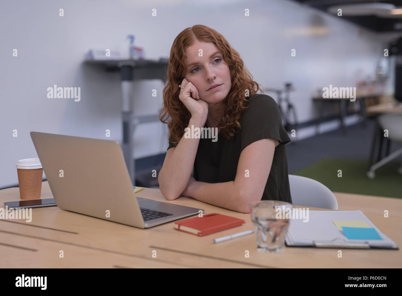 Female executive sitting hi-res stock photography and images - Alamy