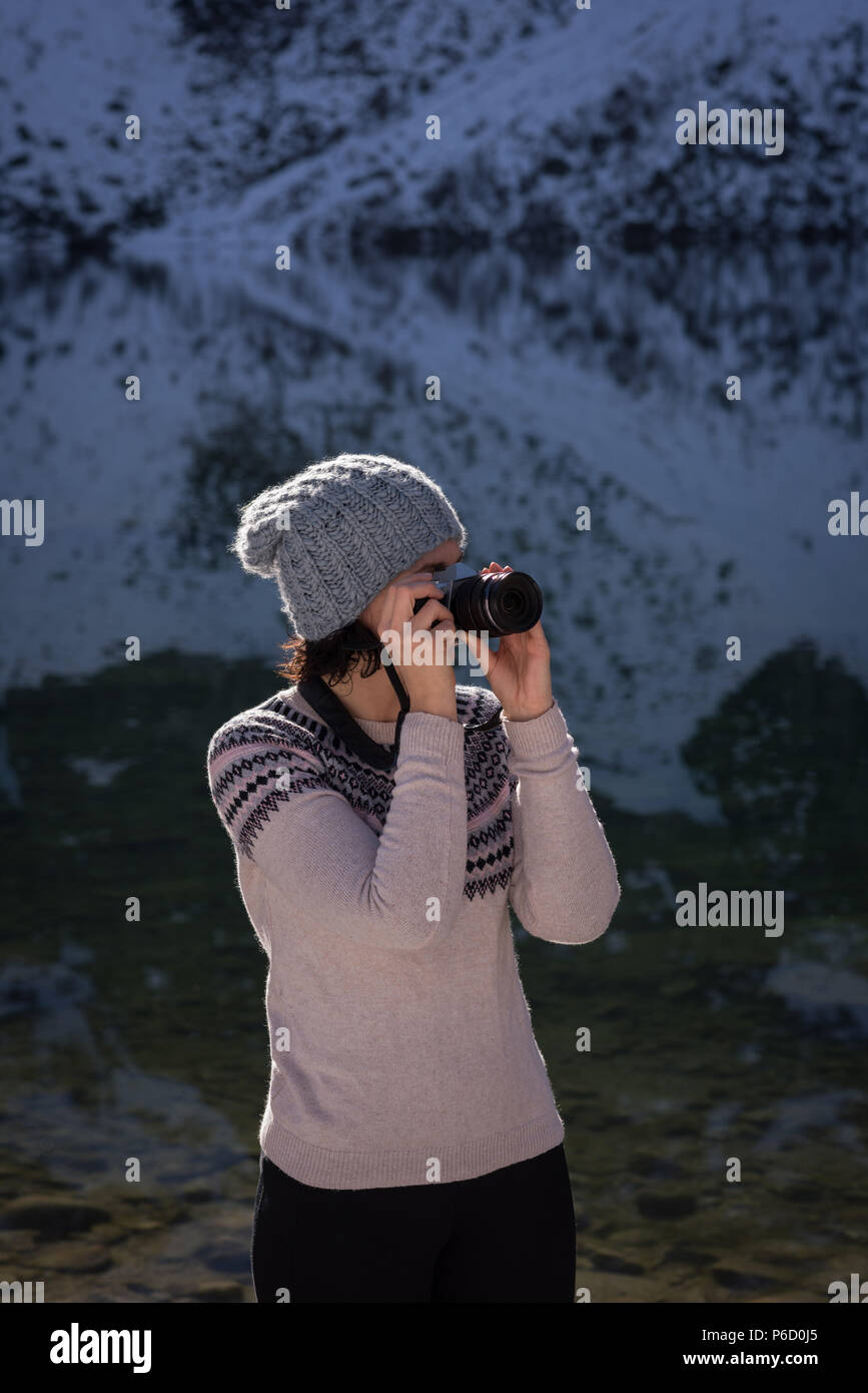 Female hiker taking photo with digital camera Stock Photo - Alamy
