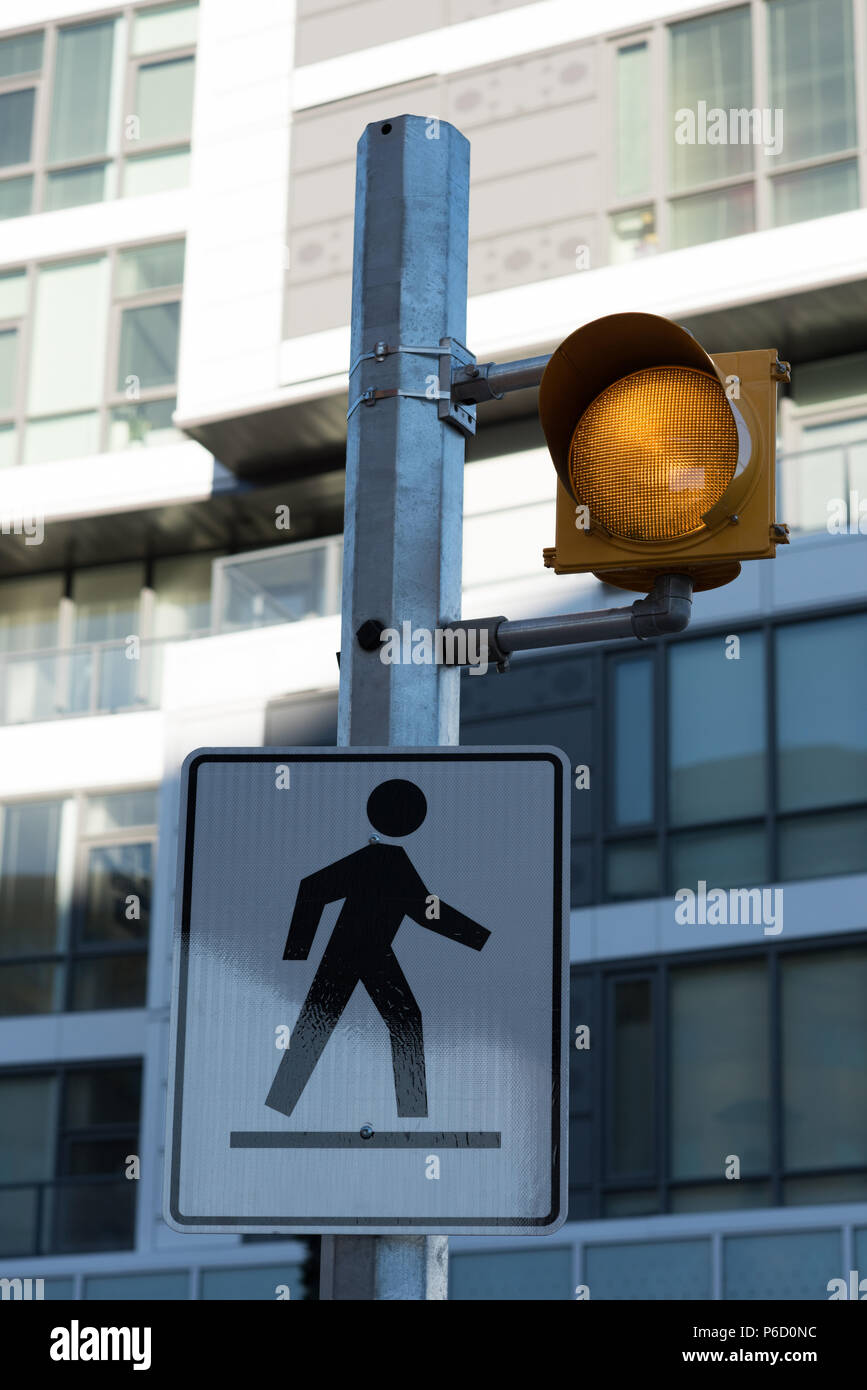 Pedestrian crossing sign on traffic signal Stock Photo - Alamy