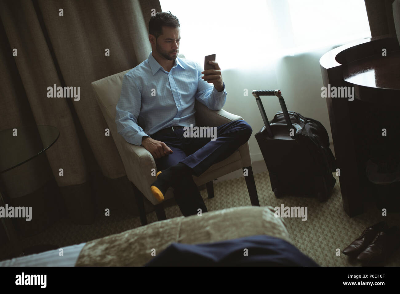 Businessman using mobile phone Stock Photo - Alamy