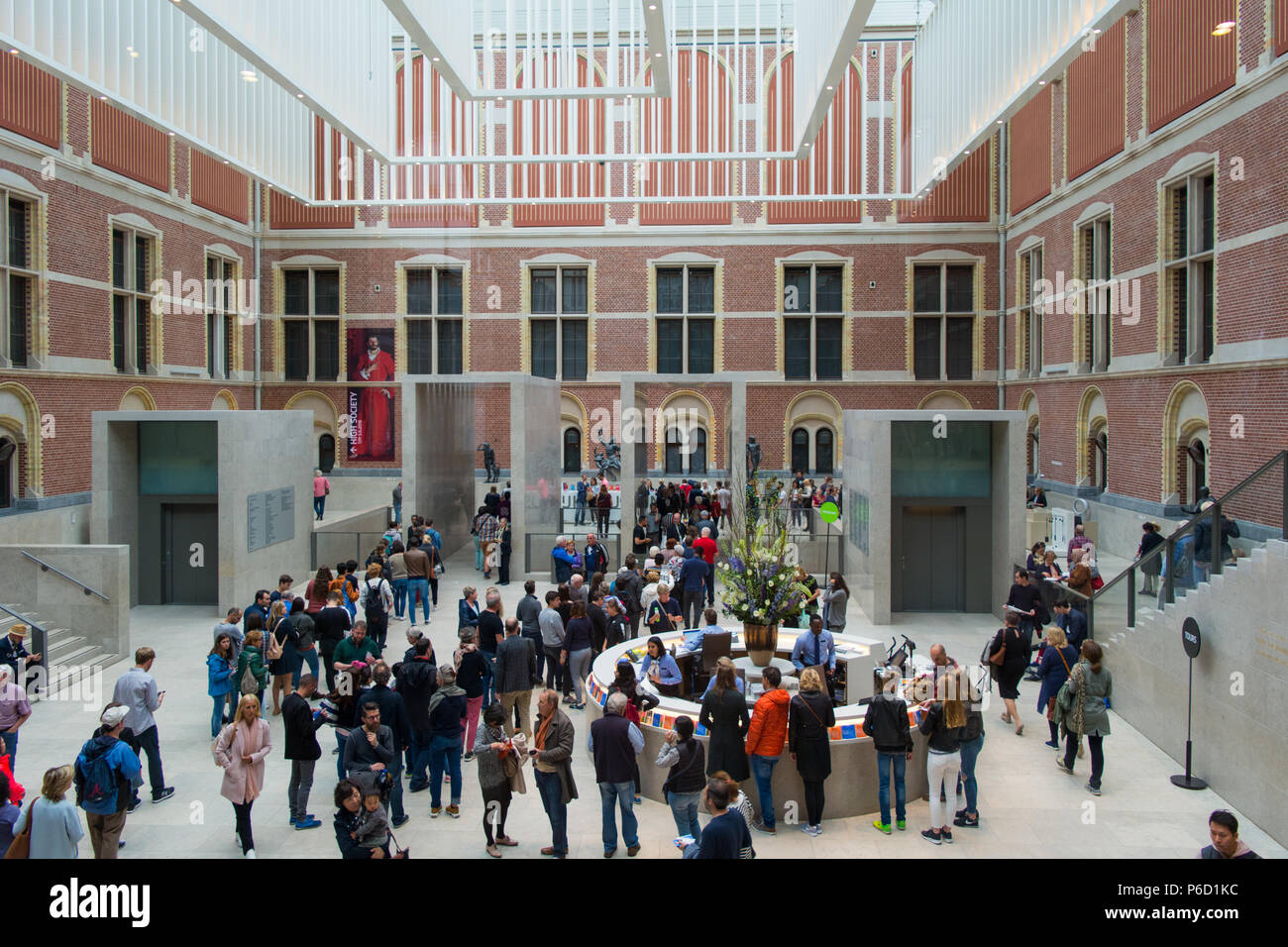 Amsterdam, Netherlands - May 2018: Visitors in modern main hall in the ...