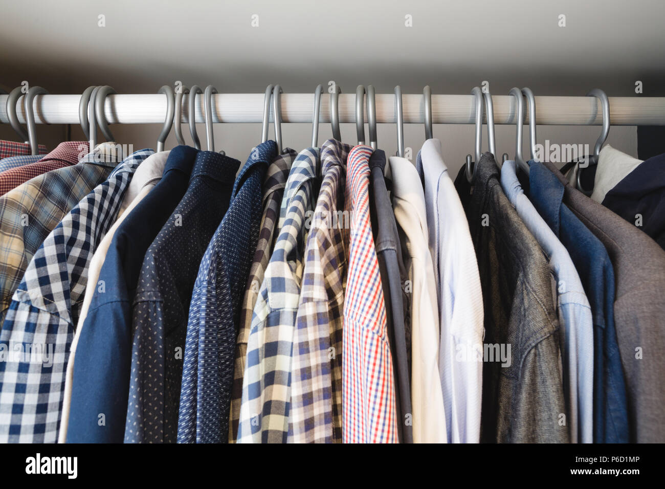 Hanging shirts hi-res stock photography and images - Alamy