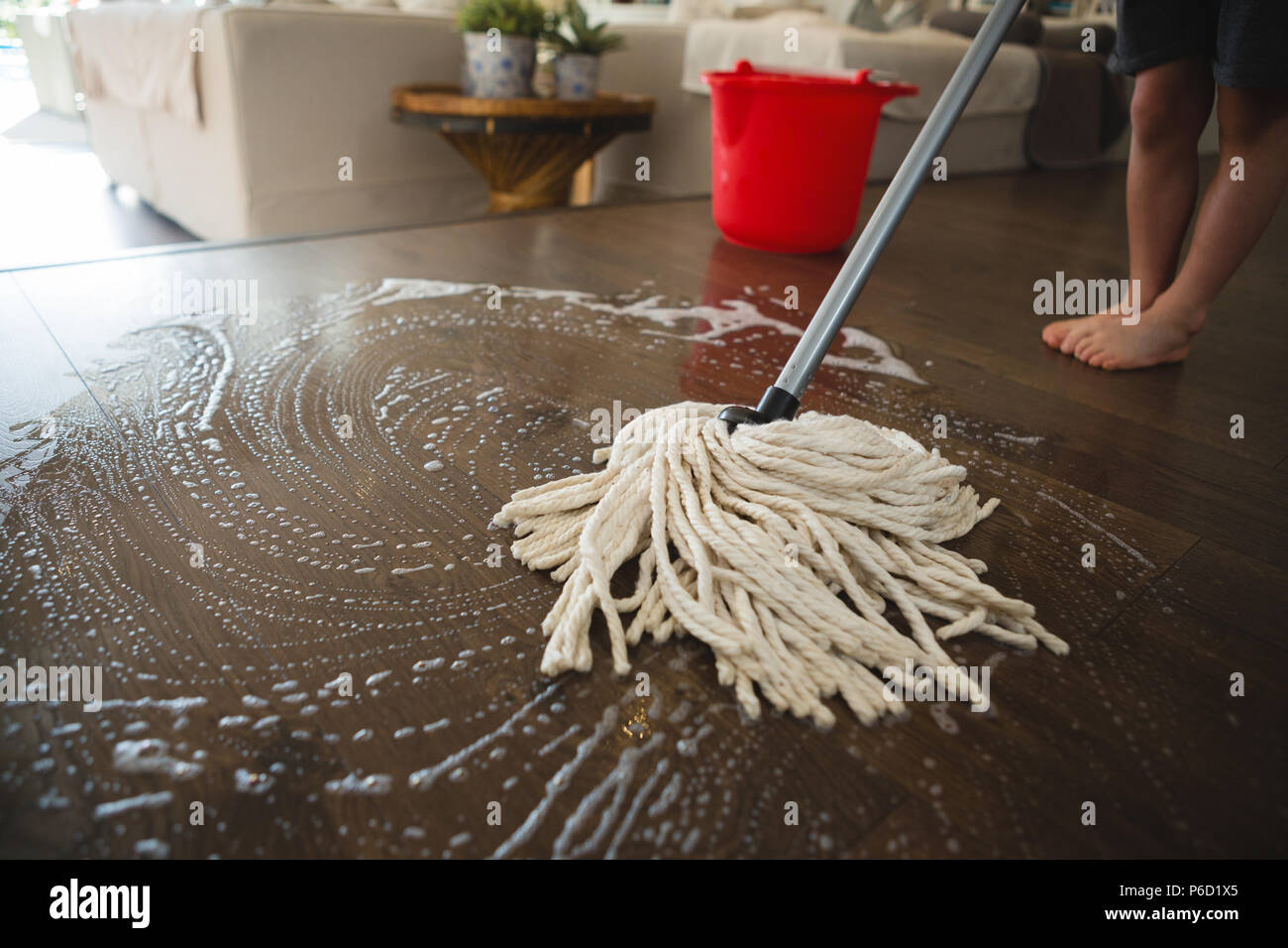 Boy washing the floor with mop at home Stock Photo - Alamy