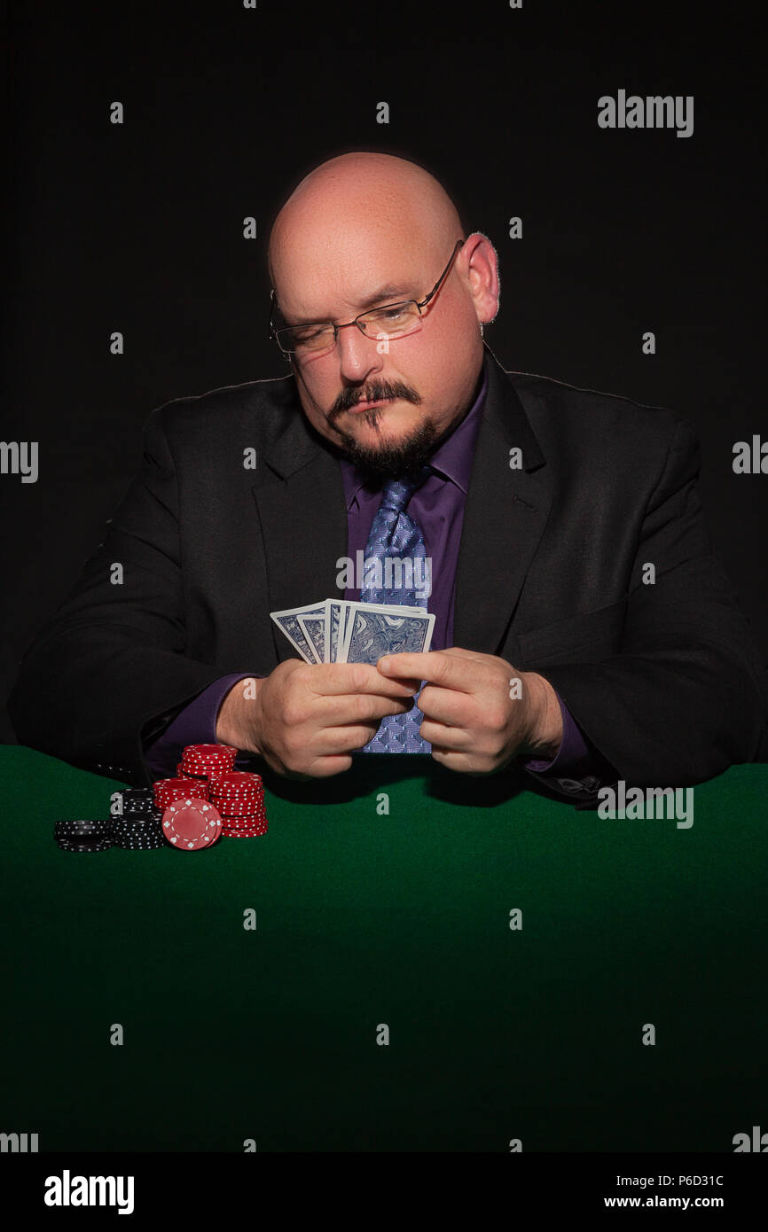 card player in business suit. Glasses and necktie with gaming chips ...
