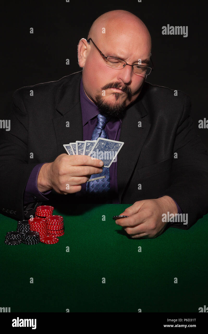 card player in business suit. Glasses and necktie with gaming chips ...