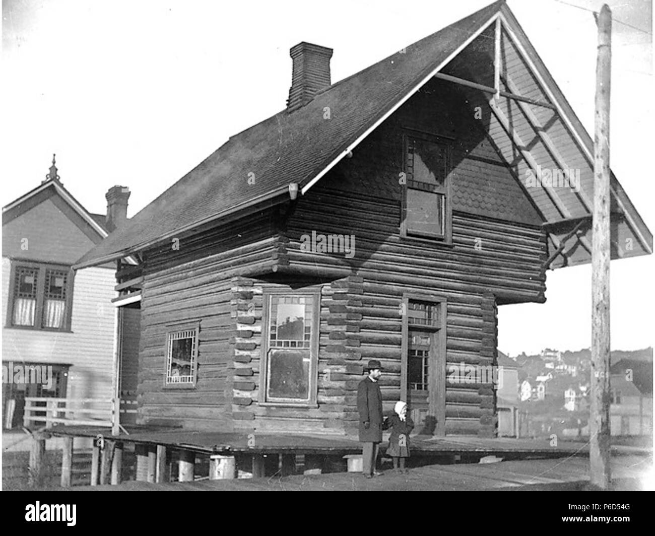 . English: Log house school on the southwest corner of Queen Anne Ave ...