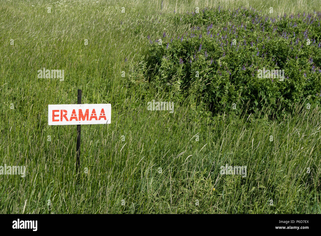 Red painted sign in Estonian language saying Private Land Stock Photo ...